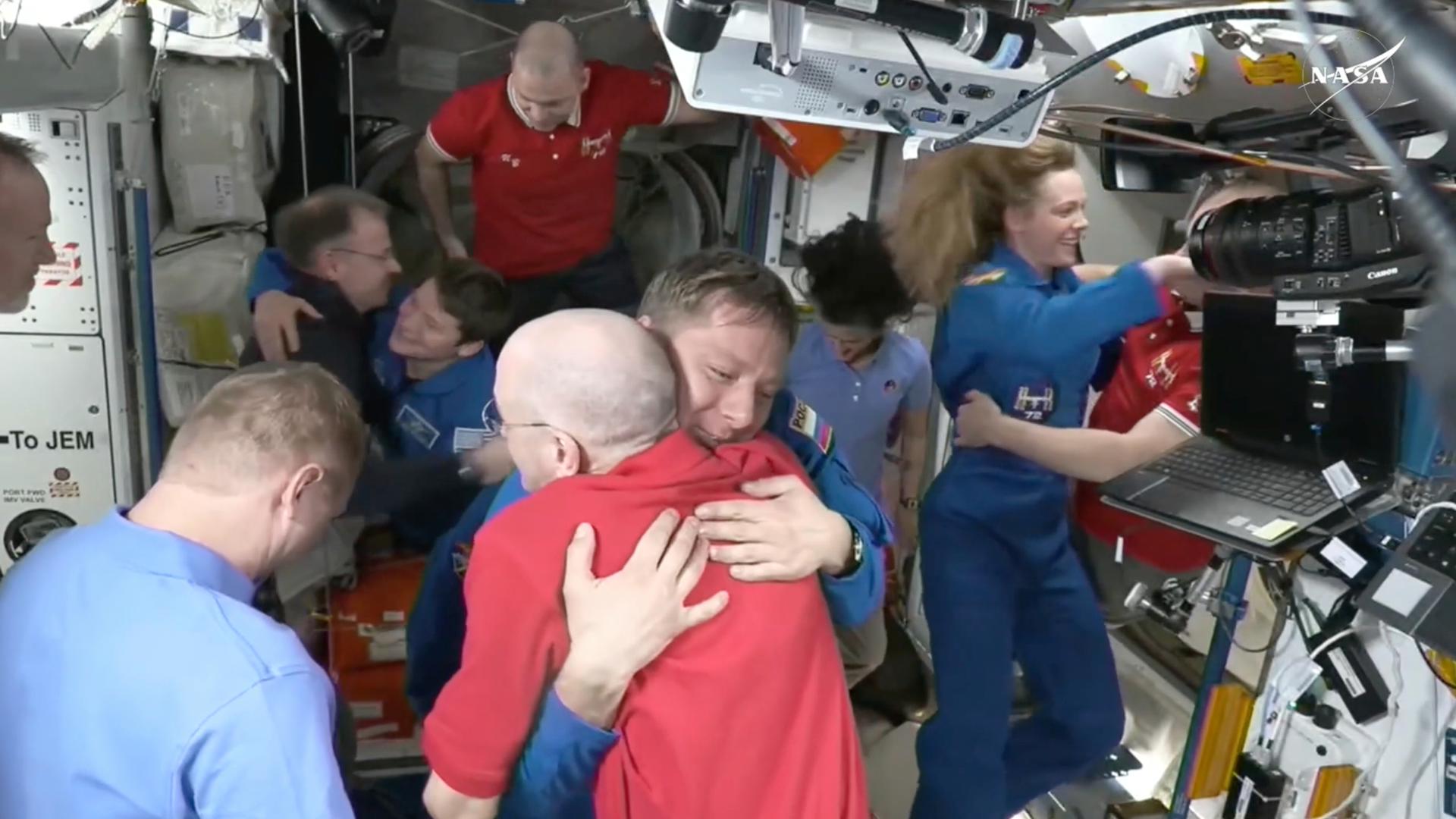 NASA's stuck astronauts greet newly arrived crew to the space station ...