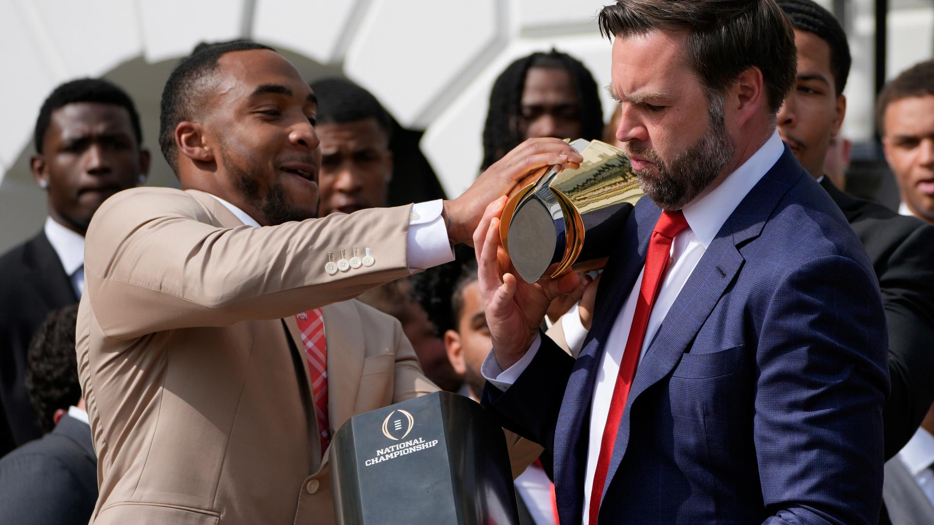 JD Vance fumbles college football championship trophy | 11alive.com