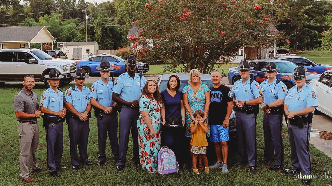 Georgia State Patrol walks fallen trooper's daughter to school ...
