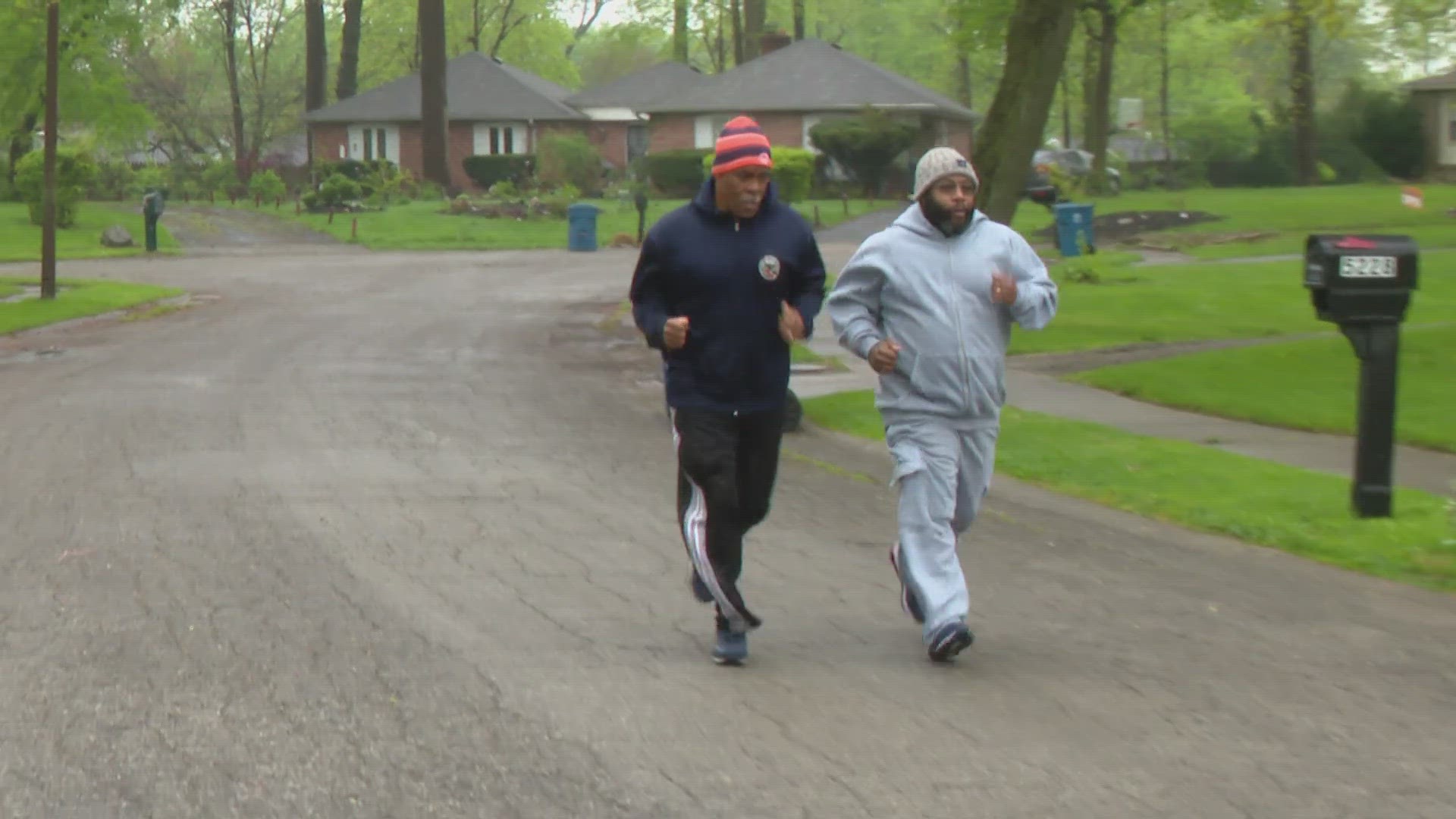 Visually-impaired runner & guide running in Indy Mini | 11alive.com