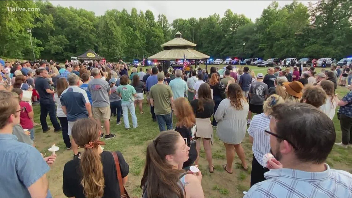 Wife of Officer Joe Burson greeted by hundreds at vigil | 11alive.com