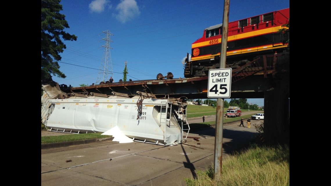 Train cars fall off bridge onto Texas road | 11alive.com