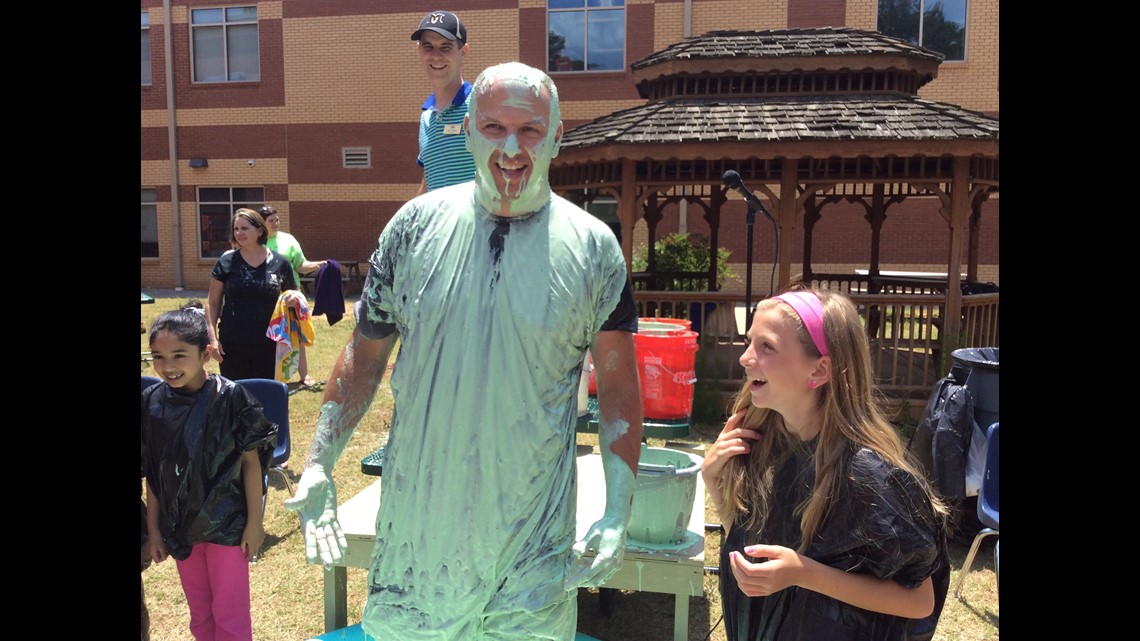 Students slime principal as reward for reading | 11alive.com