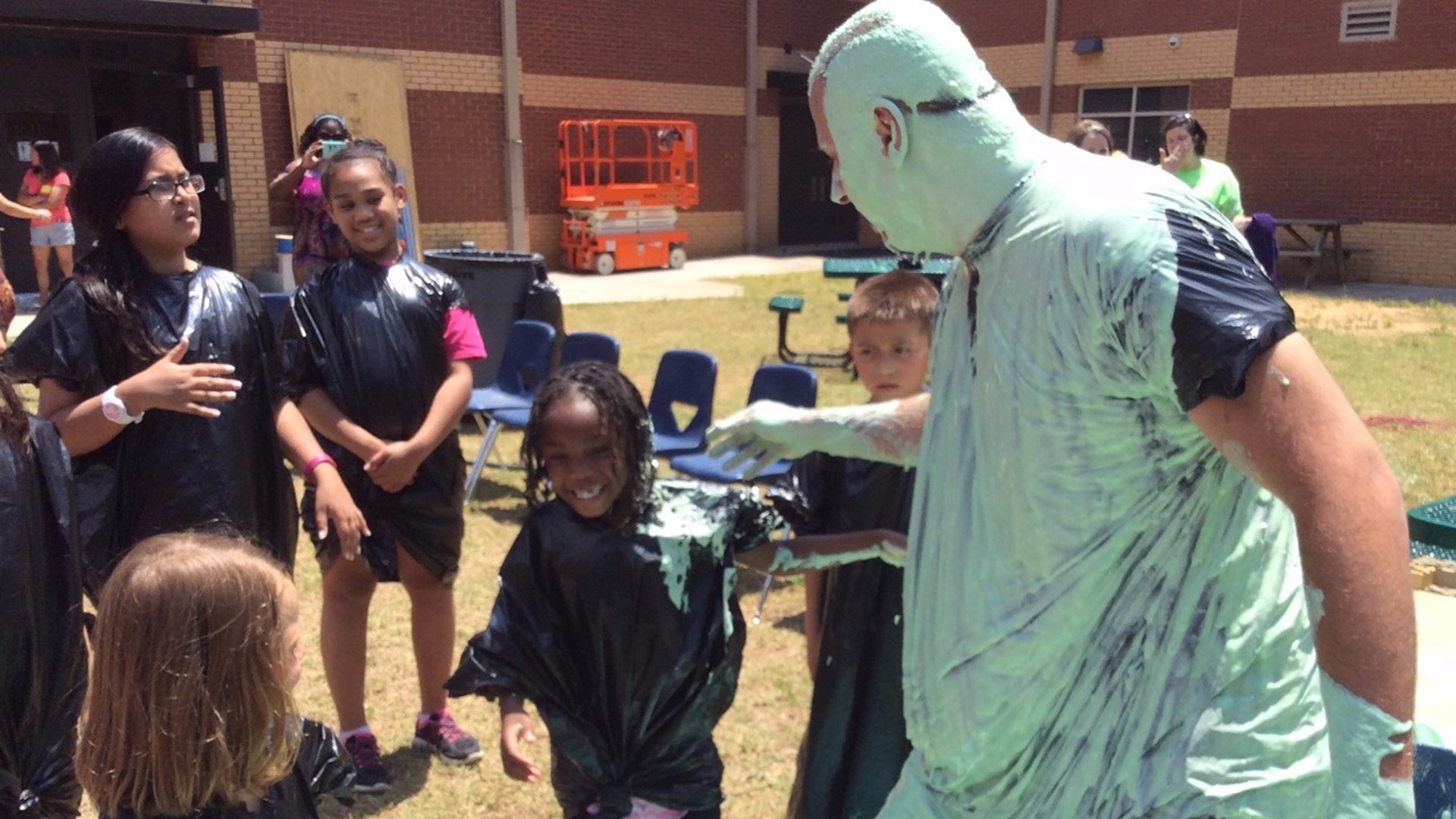 Students slime principal as reward for reading | 11alive.com