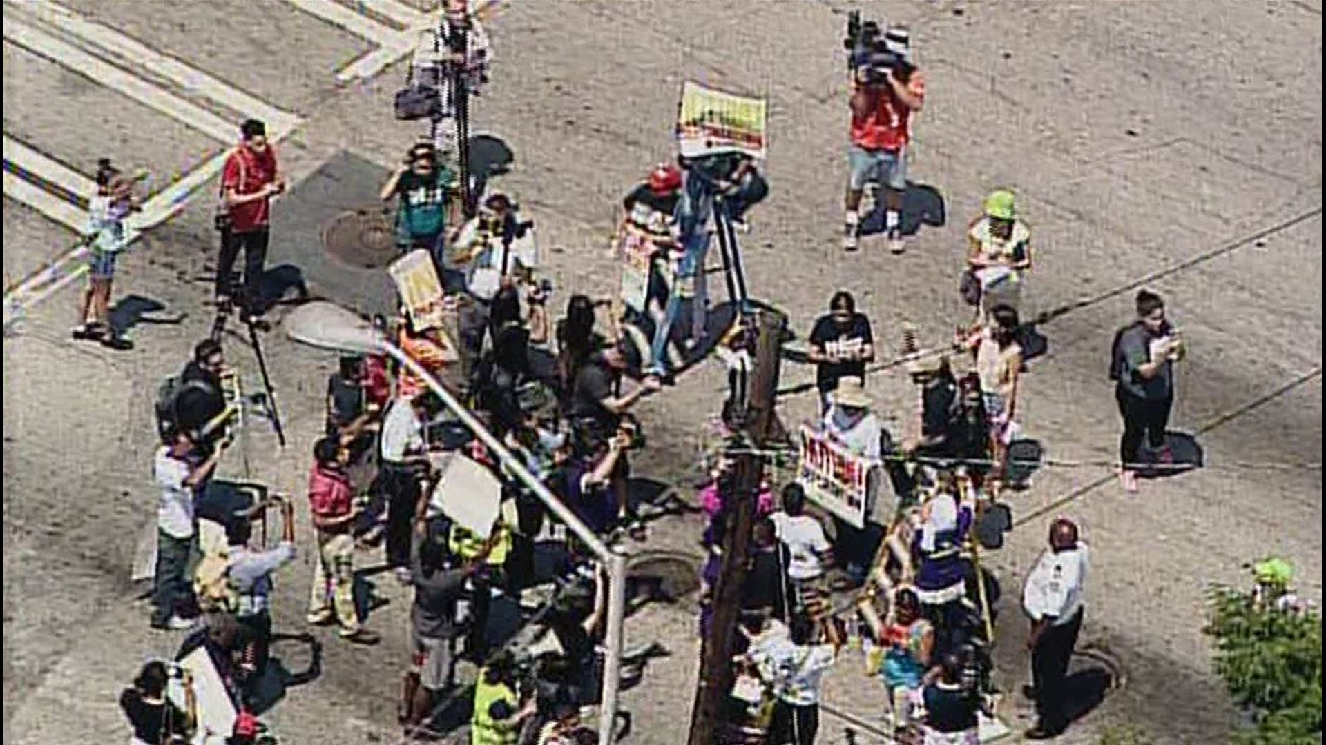 Protestors block streets, chain selves to ladders during deportation ...