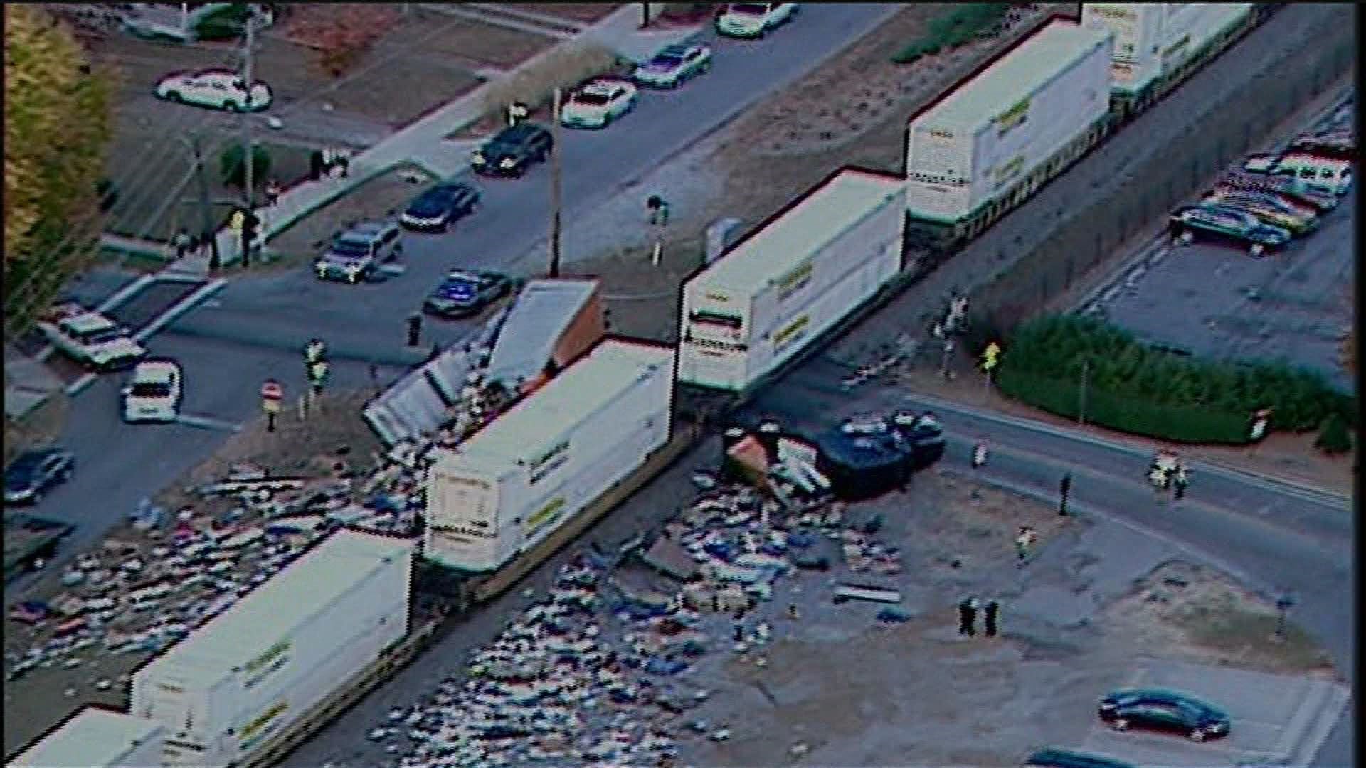 Crash between train, tractor-trailer flings debris into intersection ...
