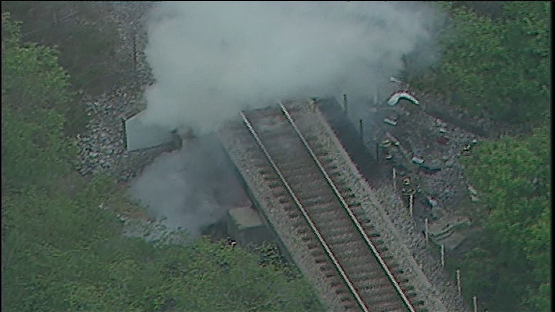 Fire burns under railroad trestle Thursday morning | 11alive.com