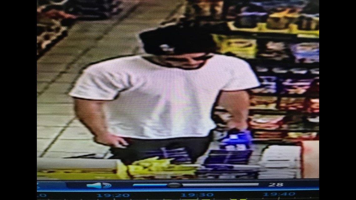Photos: Suspect grabs beer before alleged robbery | 11alive.com
