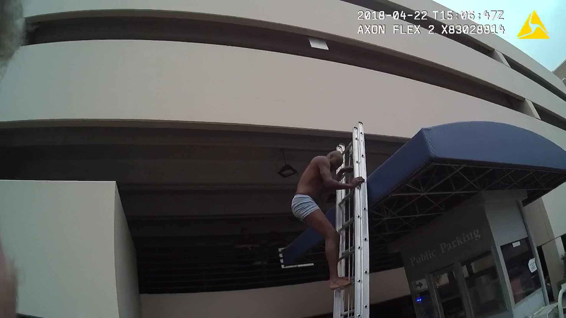 Athens man in custody after mooning officers while on top of parking ...