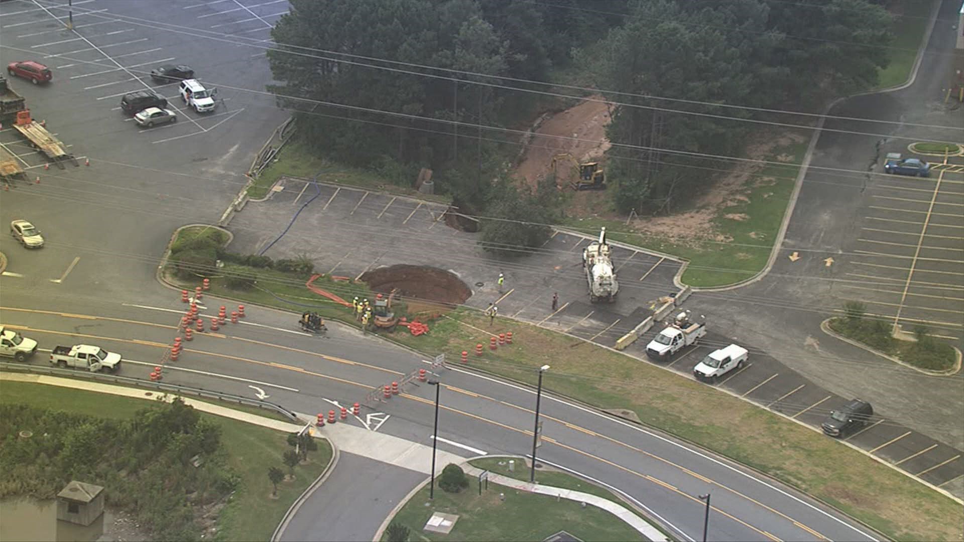 Massive sinkholes destroy metro Atlanta parking lot | 11alive.com