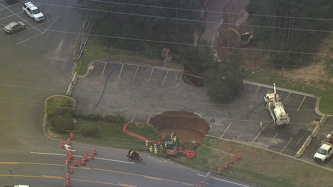 Massive sinkholes destroy metro Atlanta parking lot | 11alive.com