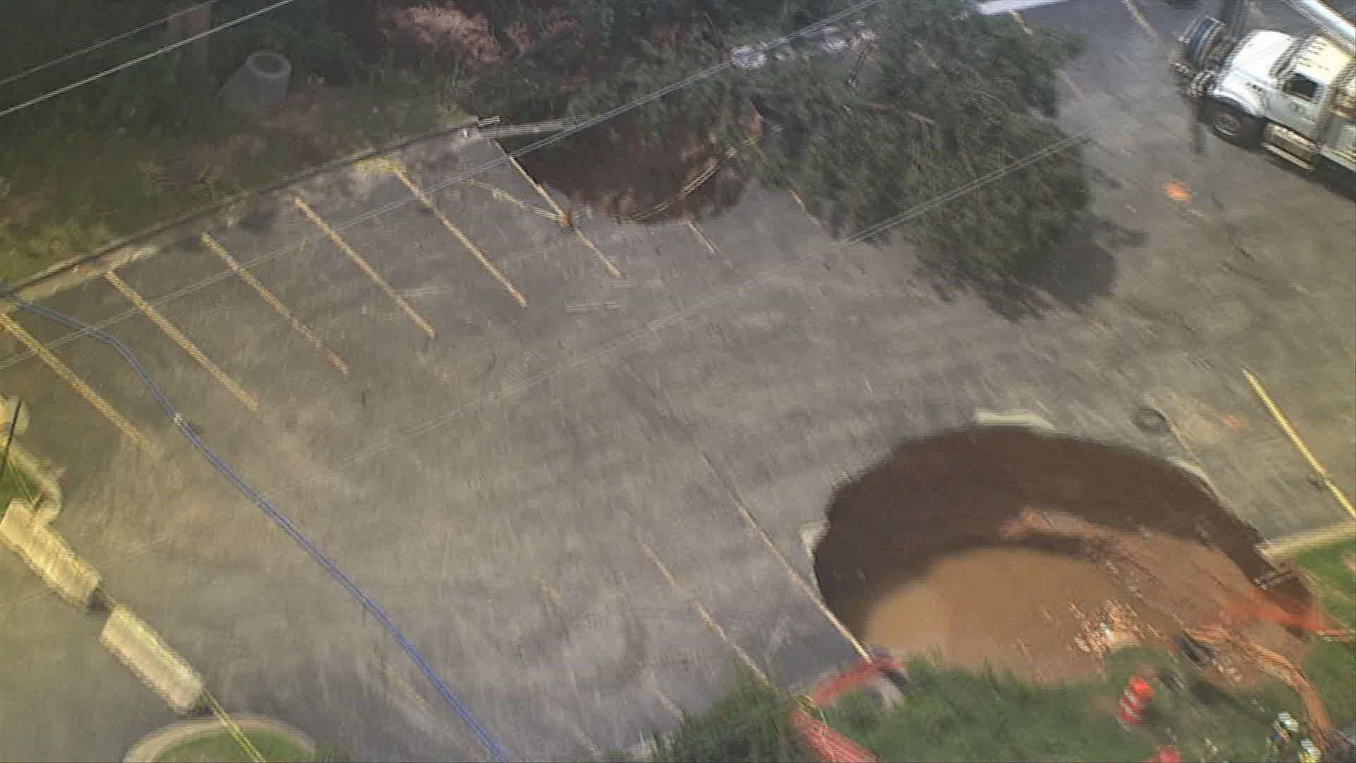 Massive sinkholes destroy metro Atlanta parking lot | 11alive.com