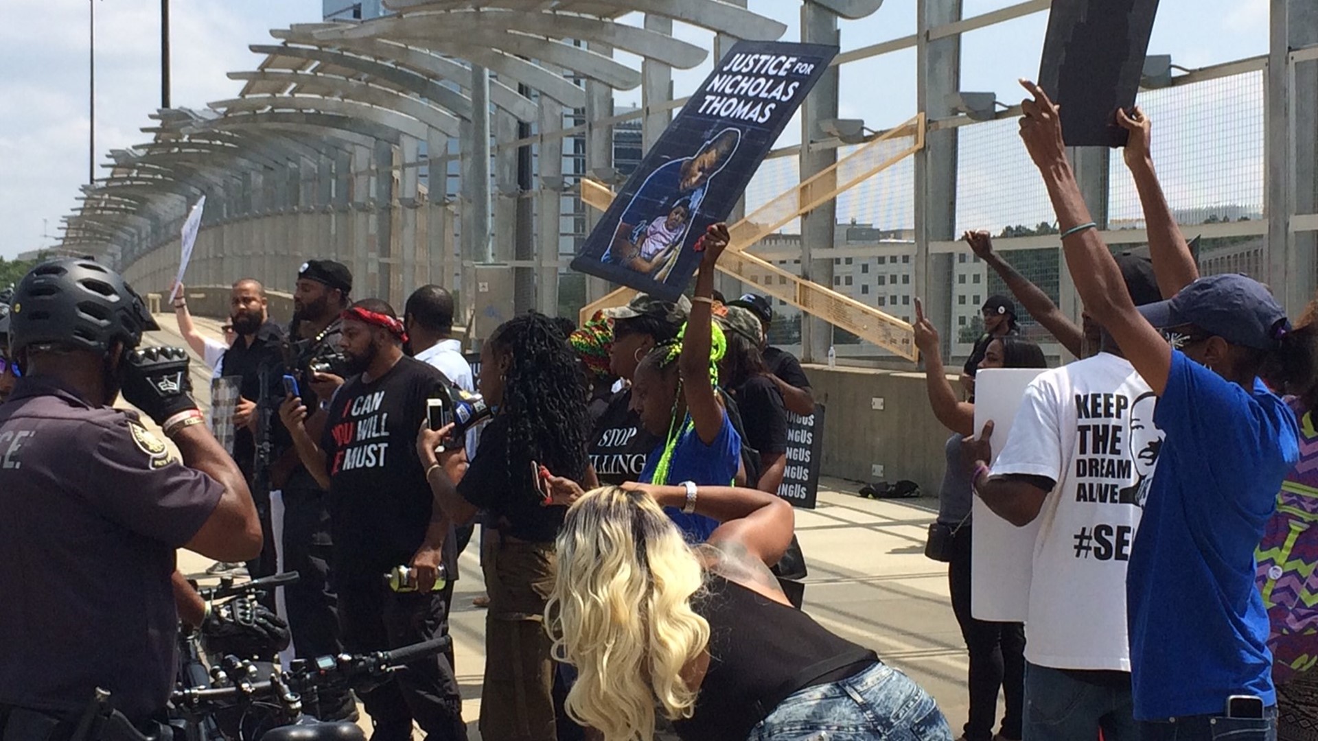Police violence protest on 17th Street bridge | 11alive.com