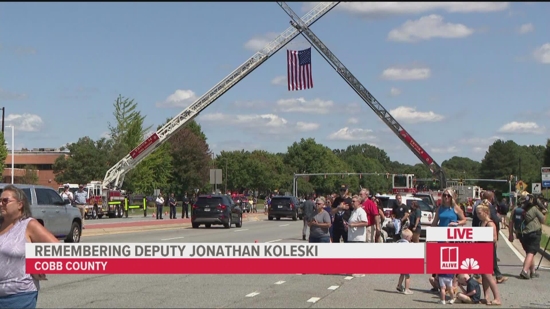 Community lines streets to remember, honor Deputy Jonathan Koleski ...