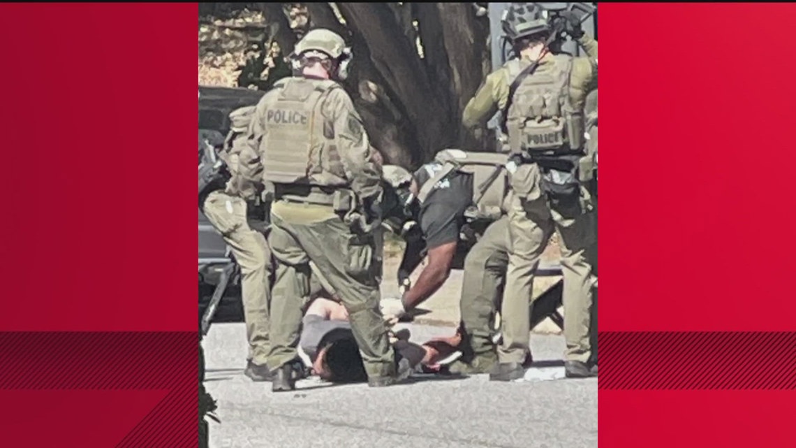 Sandy Springs officer shot, suspect under arrest after SWAT standoff ...