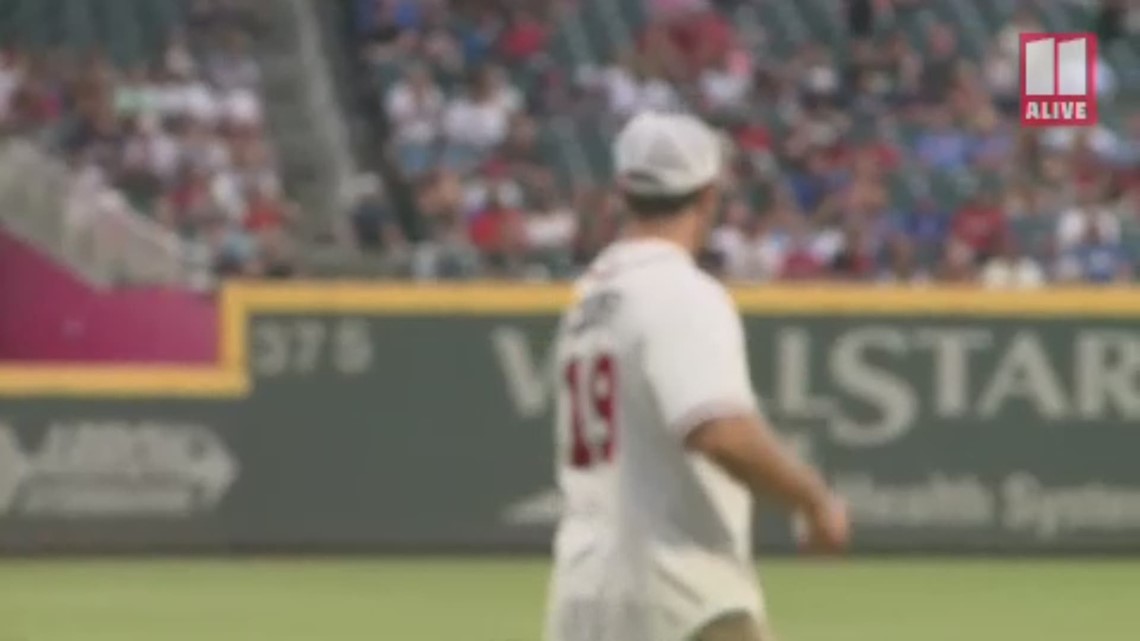 Covington police officer Matt Cooper throws out first pitch, 1 year ...
