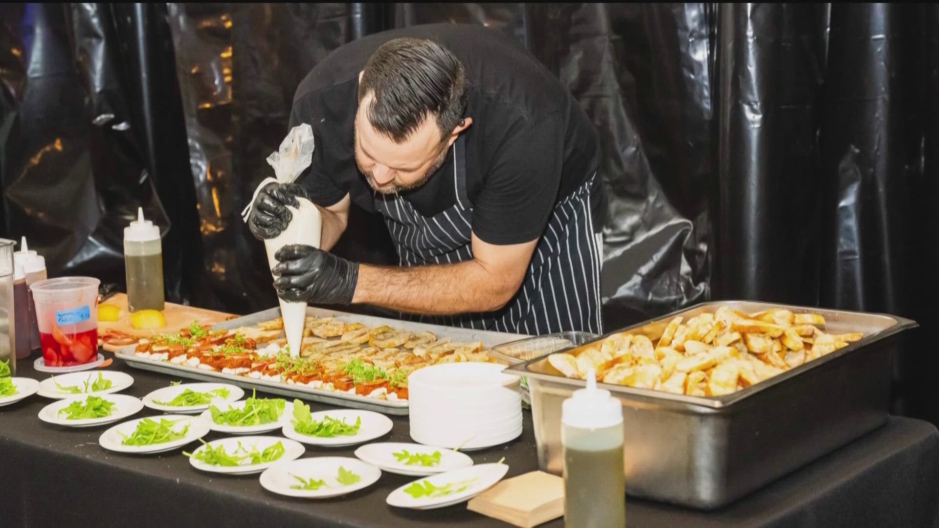 A party in the kitchen that is feeding families in need | 11alive.com