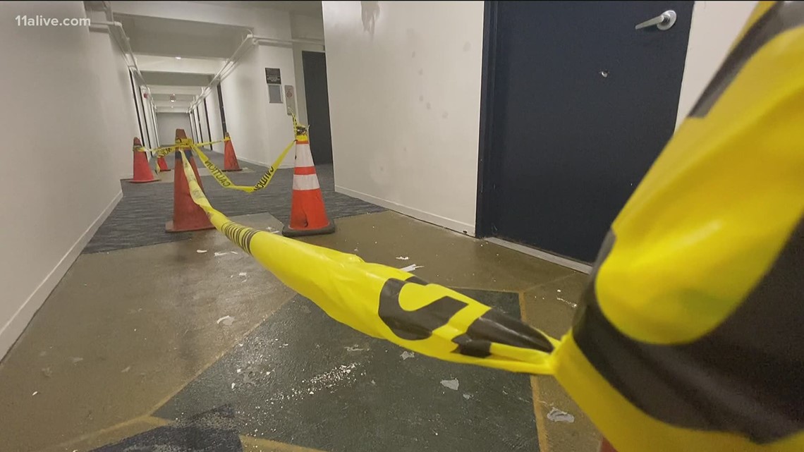 Crime scene shows scars inside Atlanta apartment building where officer ...