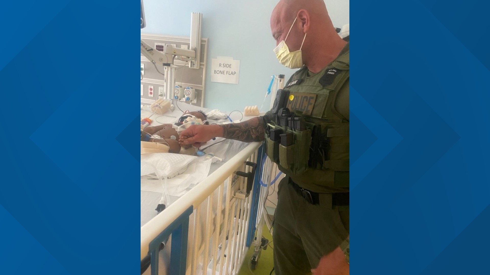 APD Officer checks up on baby he save by administering CPR | 11alive.com
