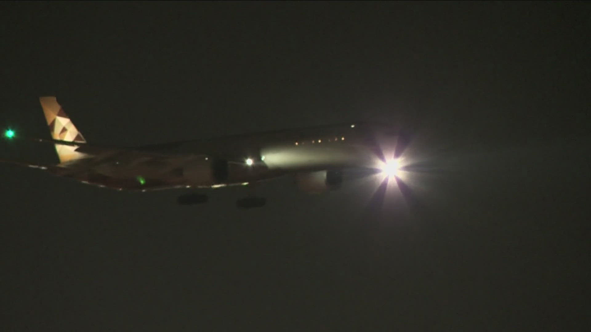 Passengers react after being one of the last flights out of Middle East ...