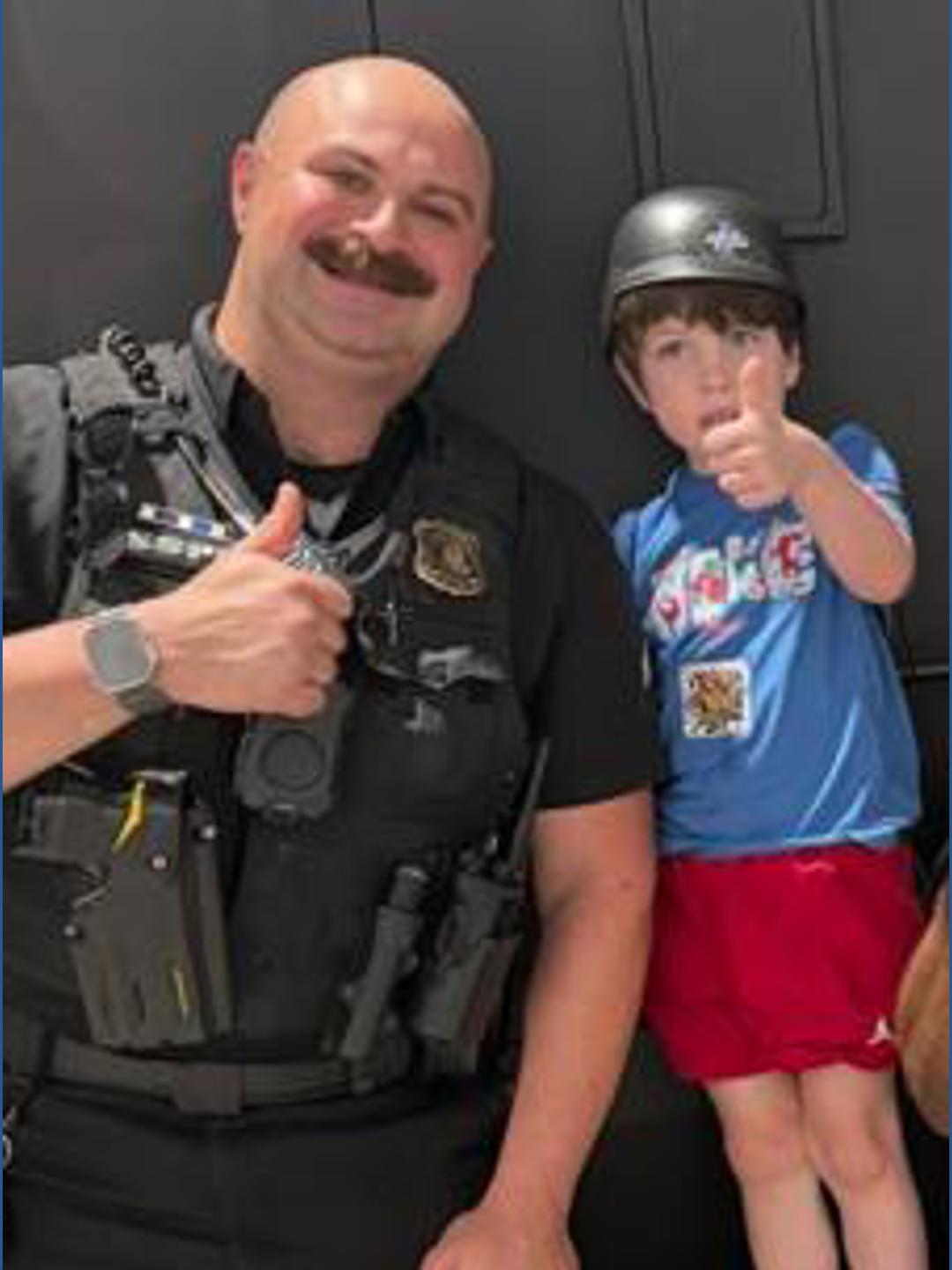 'Smiling, thriving': 4-year-old boy visits officers who helped save his ...