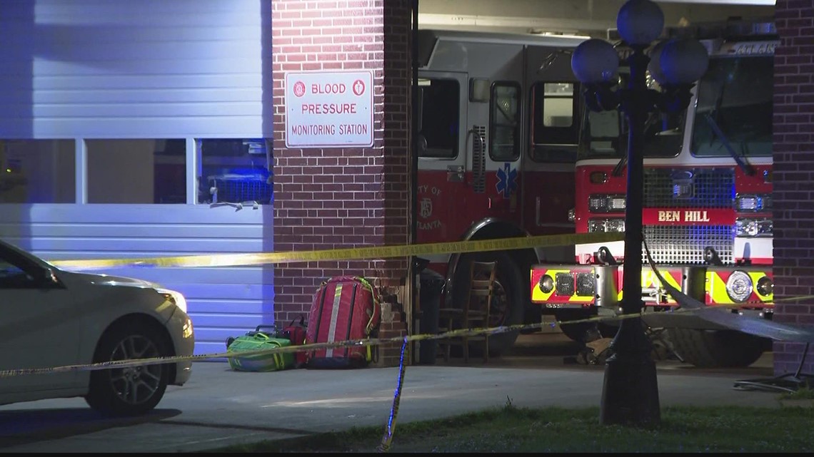 Homicide detectives working scene at fire station in southwest Atlanta ...