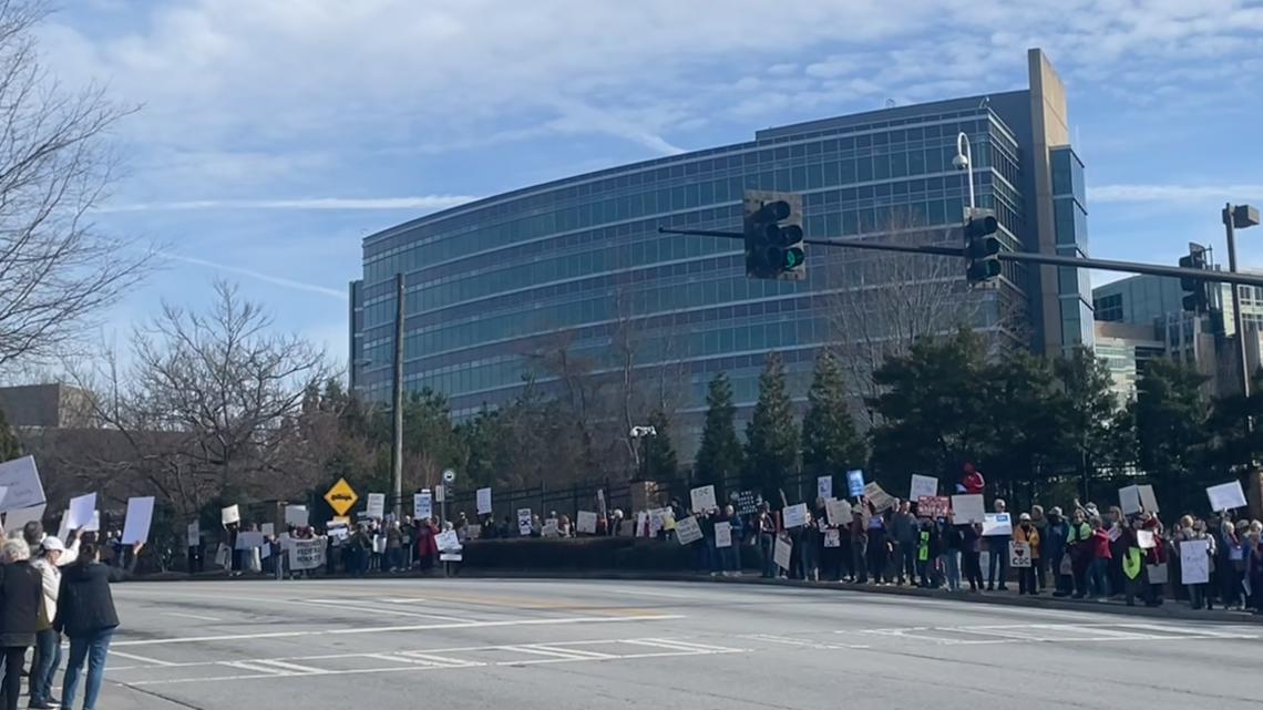 CDC employees rally after layoffs, probationary cuts | 11alive.com
