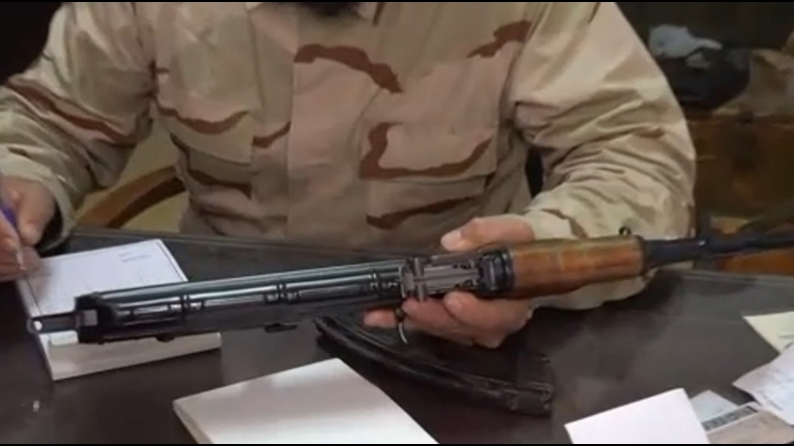 Former Assad forces hand in weapons in Syria | Raw video | 11alive.com