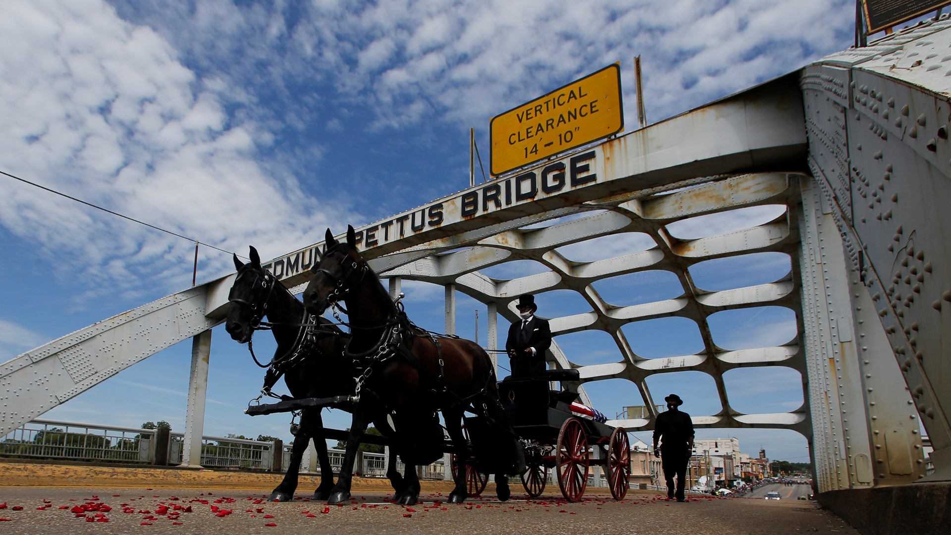 Photos: John Lewis makes the final crossing of the Edmund Pettus Bridge ...