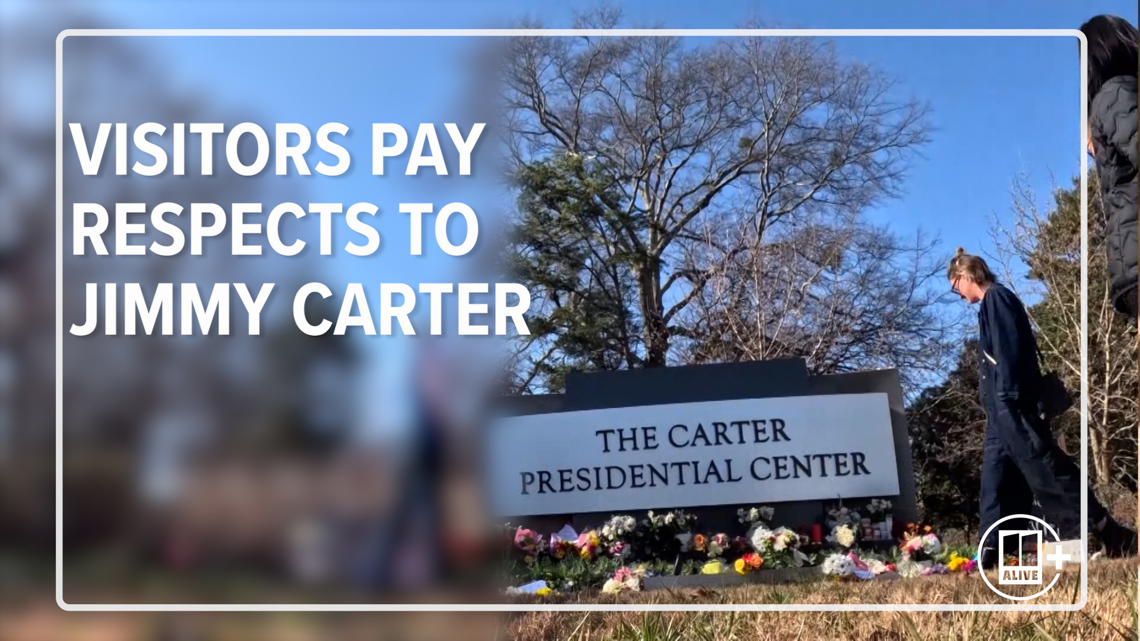 Visitors pay their respects to Jimmy Carter as the former present lies ...