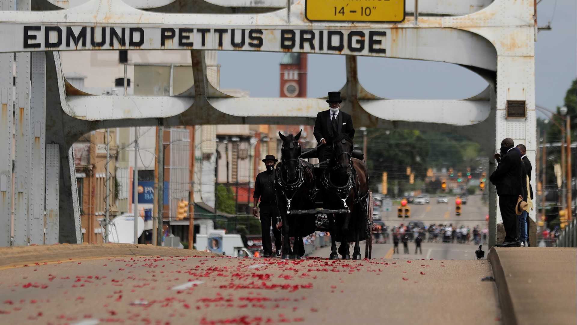 Photos: John Lewis makes the final crossing of the Edmund Pettus Bridge ...