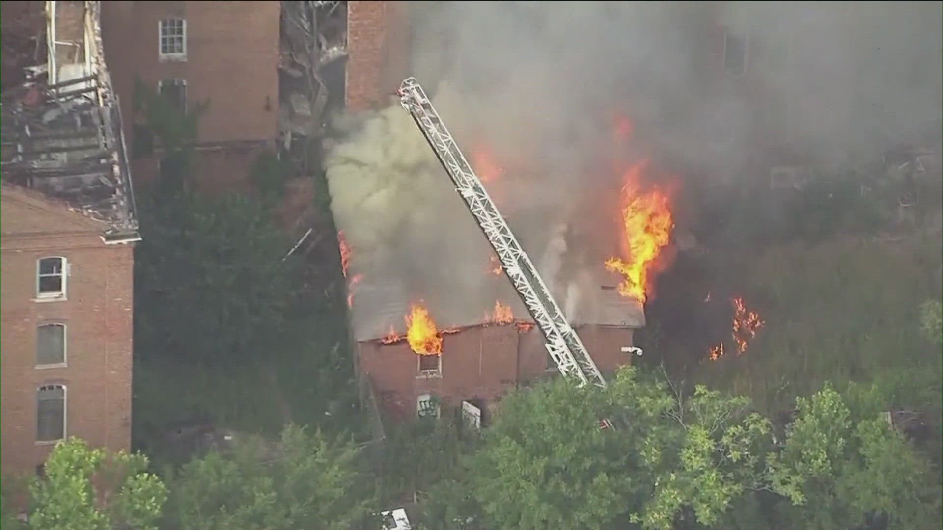 Fire crews battle blaze at previously burned historic building near ...