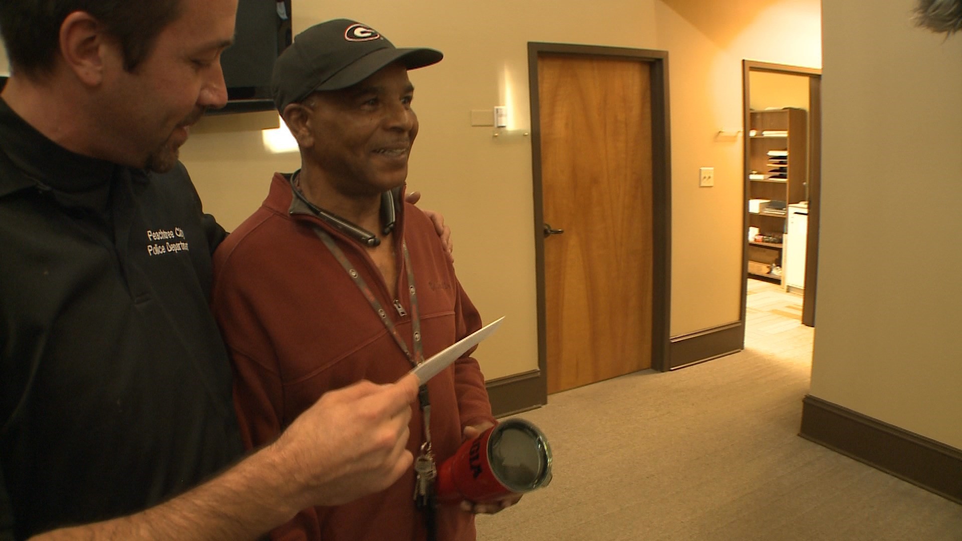 Peachtree City police department surprises beloved custodian with ...