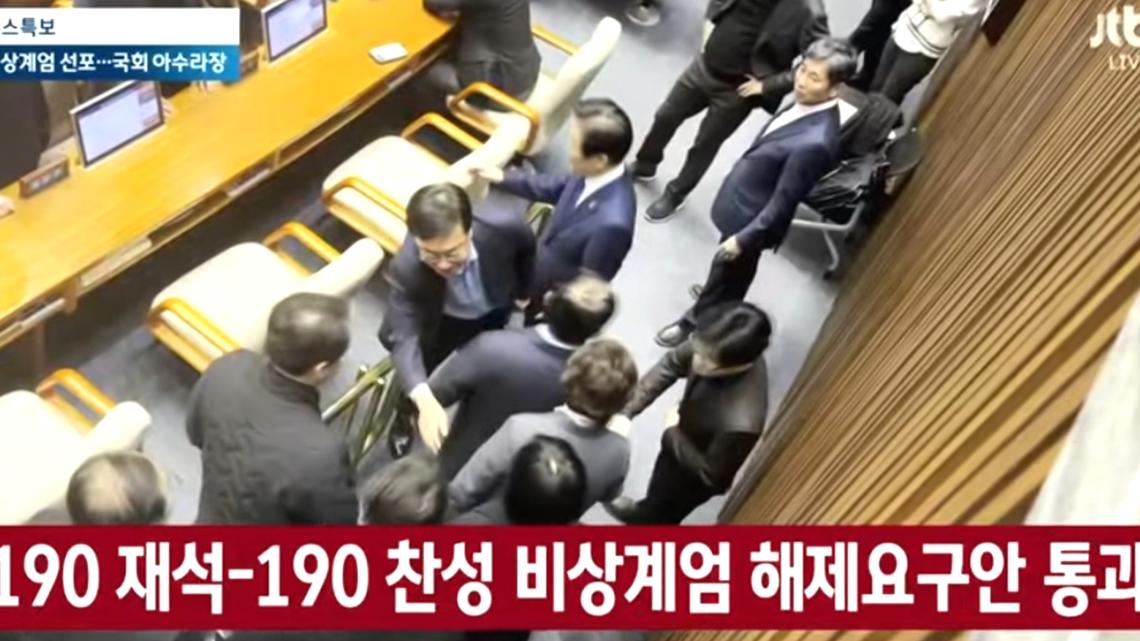 Korean lawmakers shake hands after voting down martial law | Raw ...