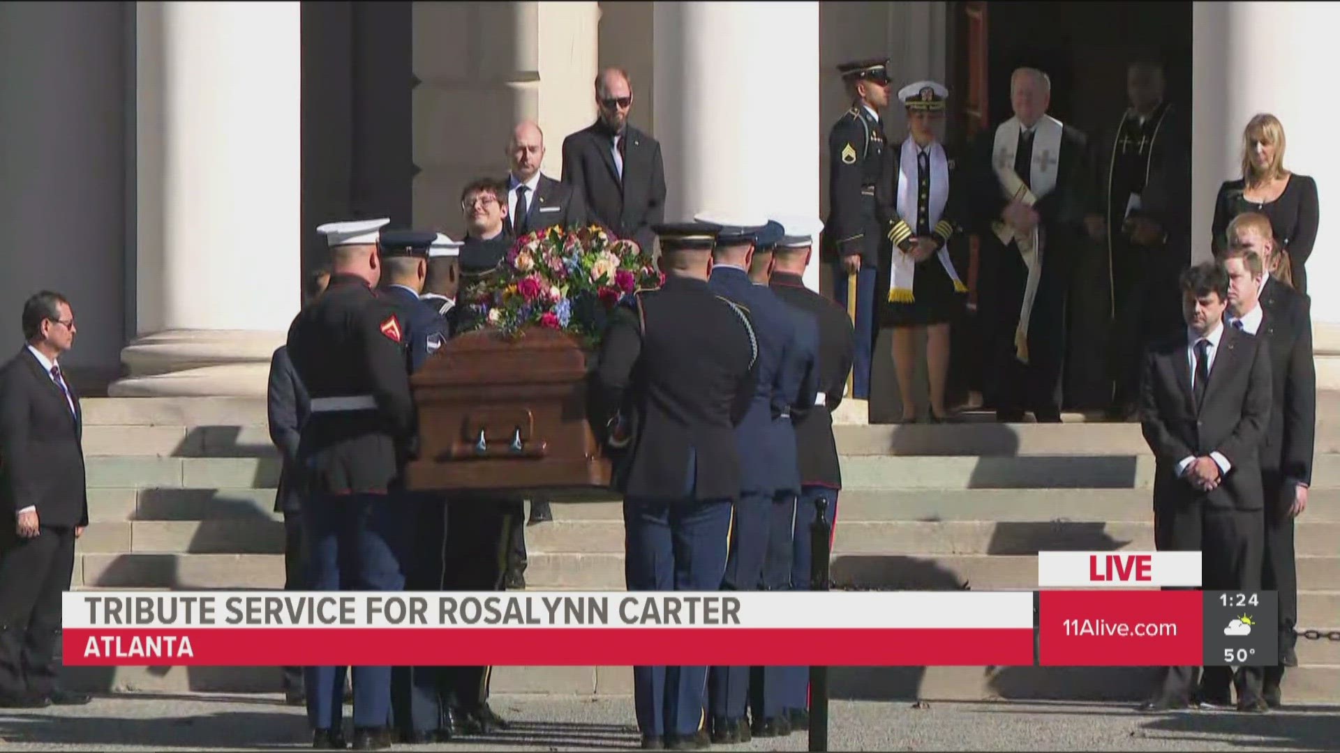 Carter family lines the entry way of the casket as honorary pallbearers ...