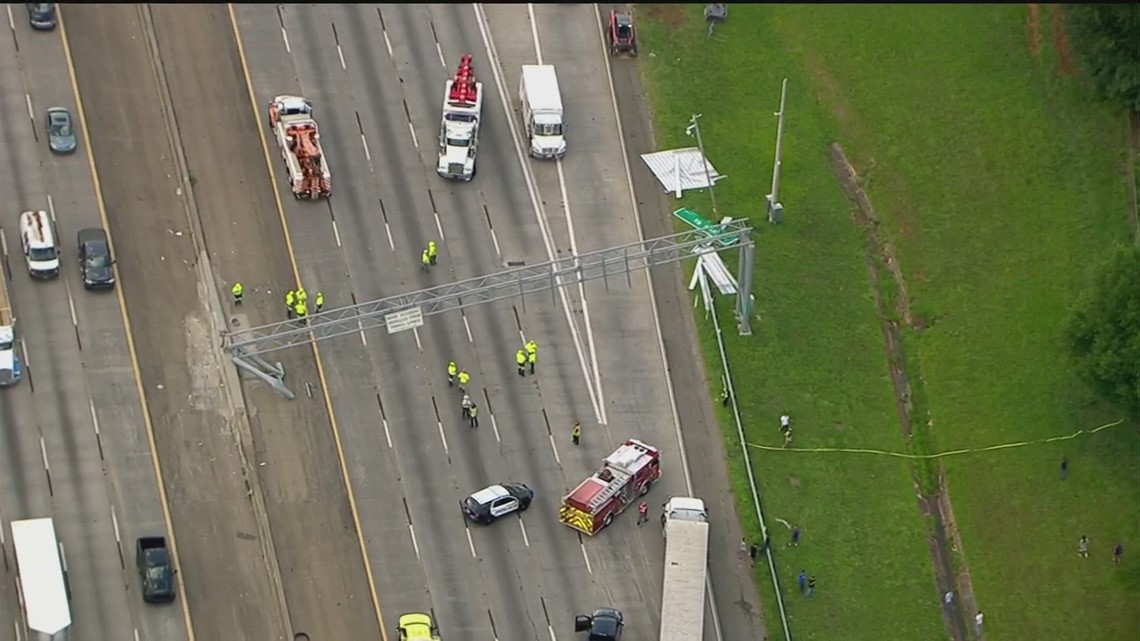 Dump truck hits overhead sign, all lanes blocked on I-75 | 11alive.com